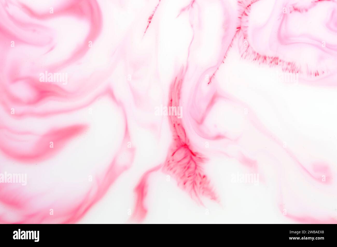 Background with red streaks on white milk. Marble texture Stock Photo - Alamy