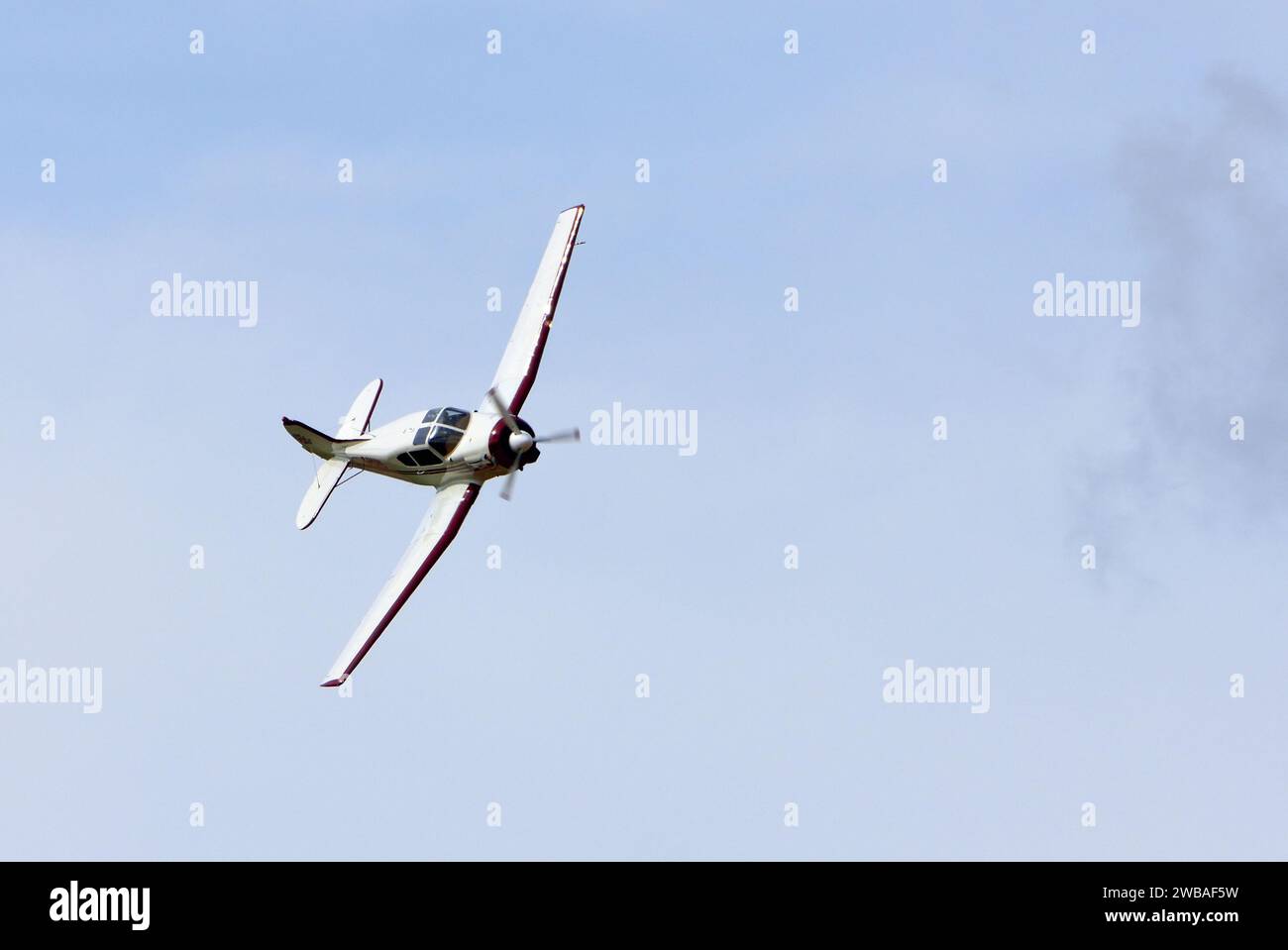 Vintage Yakovlev Yak 18T in flight against blue sky Stock Photo - Alamy