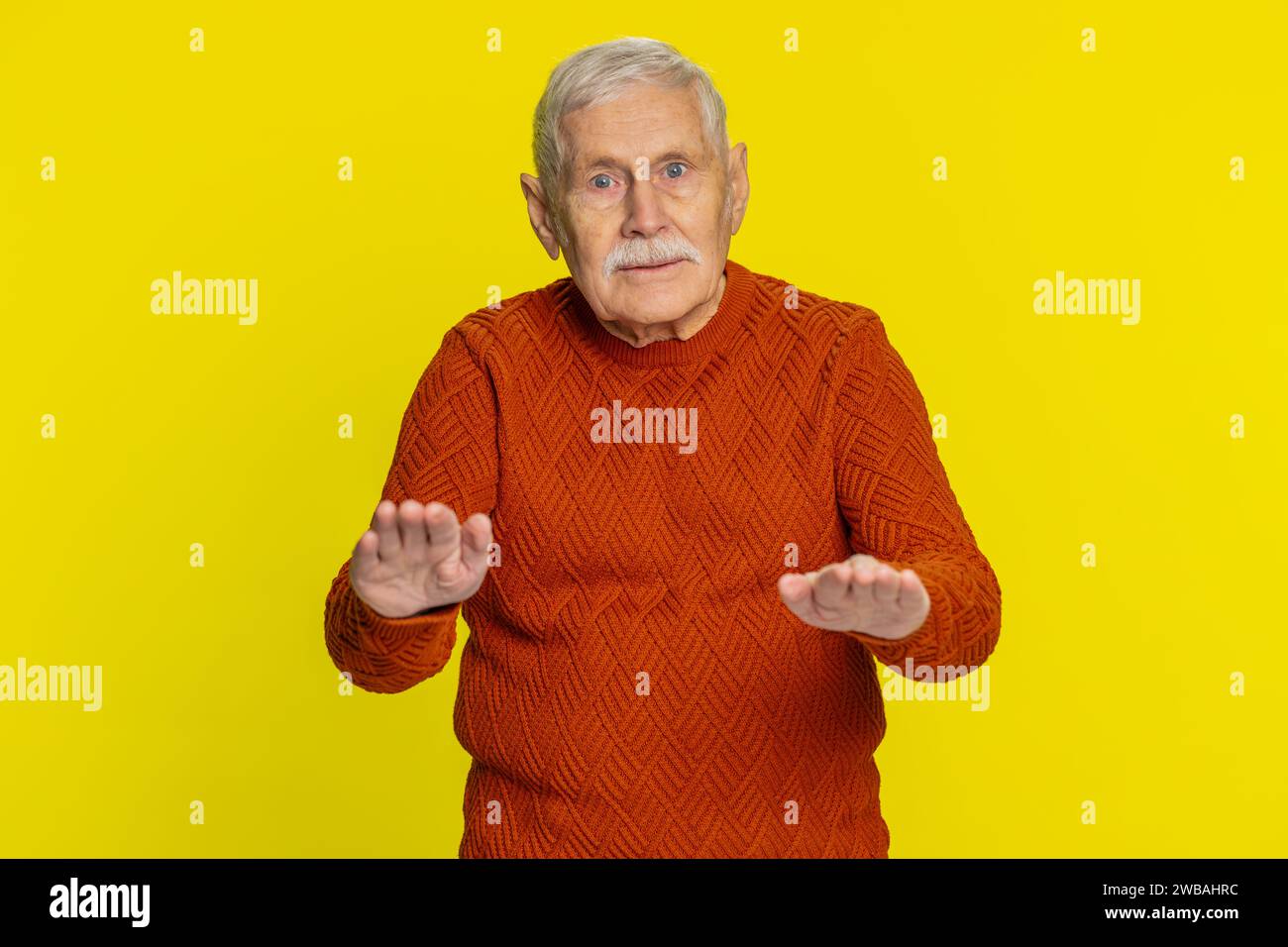 Hey you, be careful. Strict senior man warning with admonishing hands ...