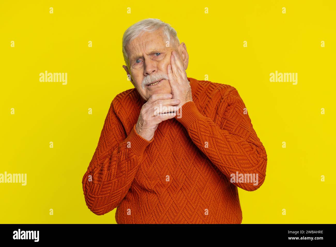 Dental problems. Senior old man touching cheek, closing eyes with ...