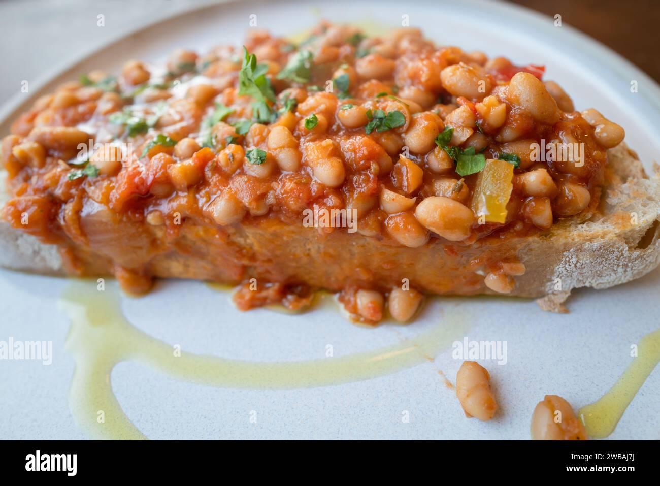 Homemade beans on toast in tomato and vegetable sauce on sourdough ...