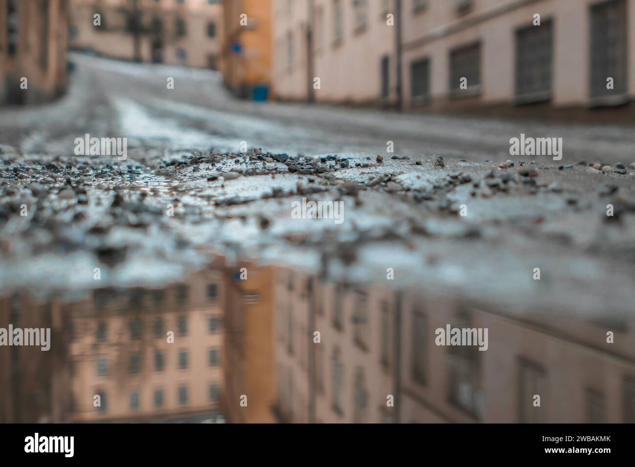 Puddle on alley street hi-res stock photography and images - Alamy
