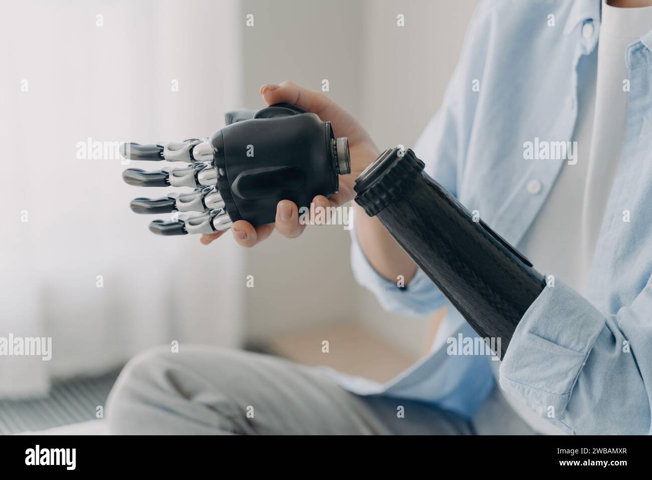 Close-up of a cutting-edge bionic hand held by a person, showcasing the ...