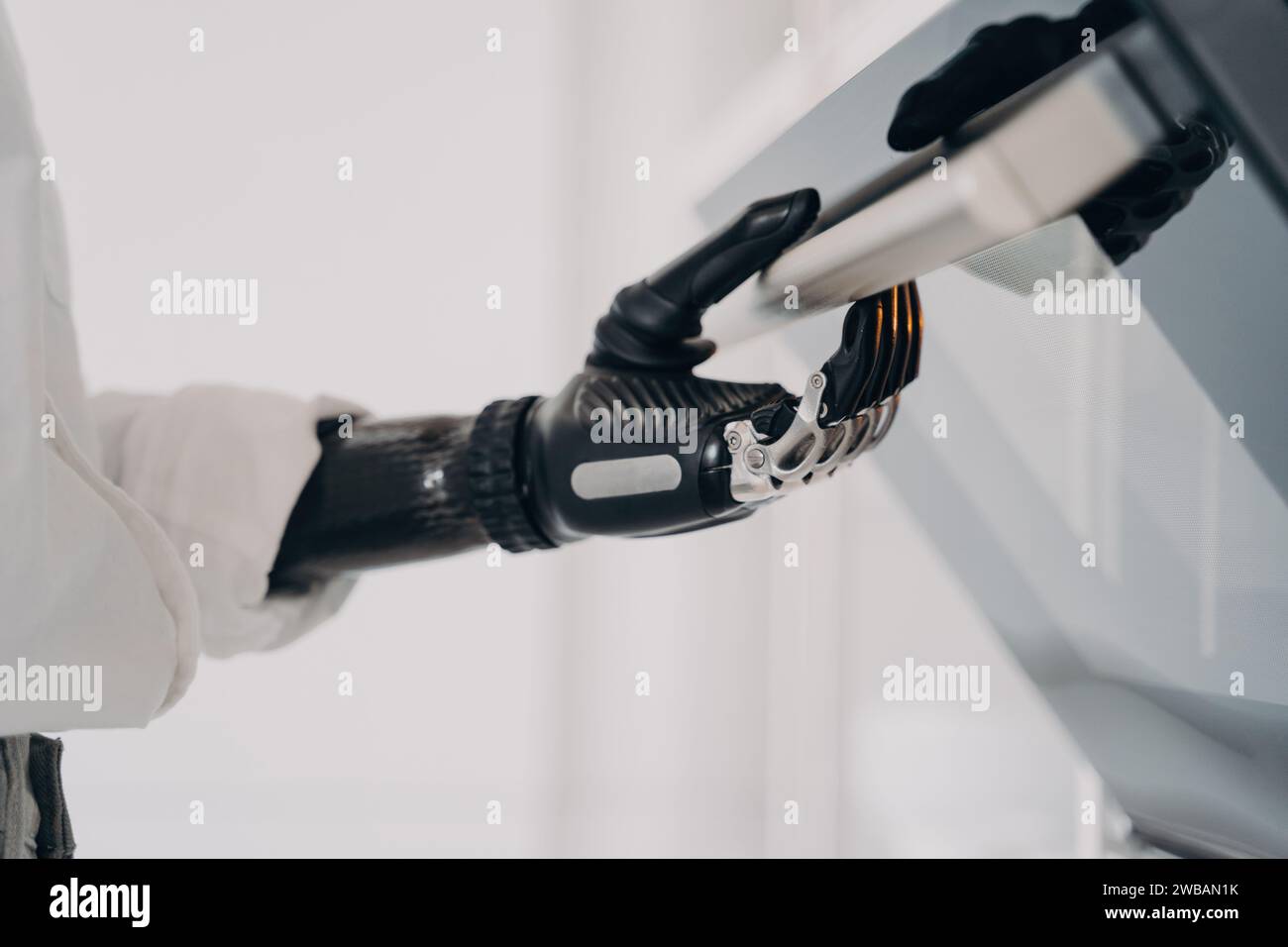 Precision and technology converge as a bionic hand operates a control ...