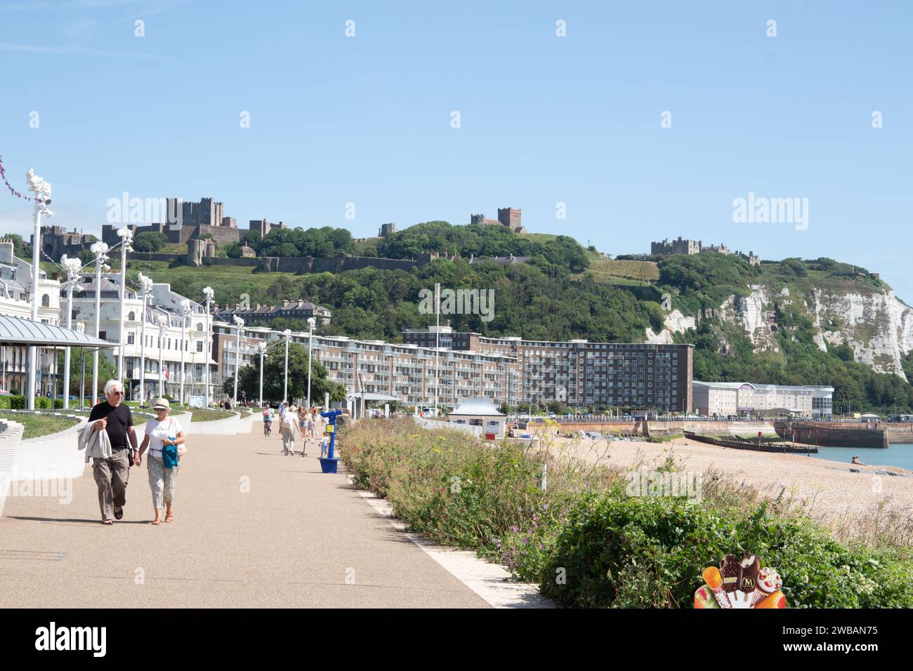 Dover sea front beach and promenade with castle above. Kent England ...