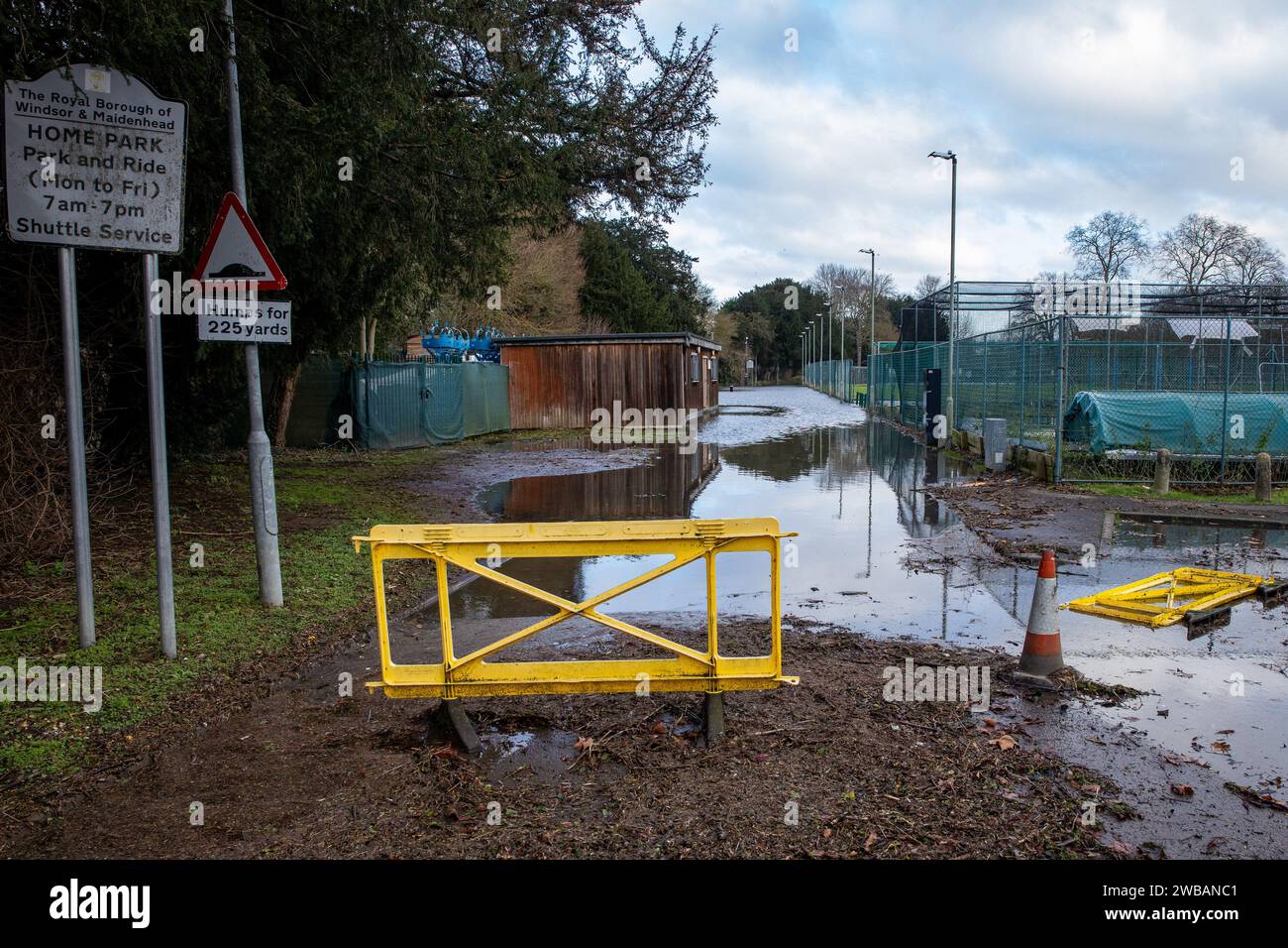 Windsor, UK. 9th January, 2024. A road blocked by floodwater from the ...