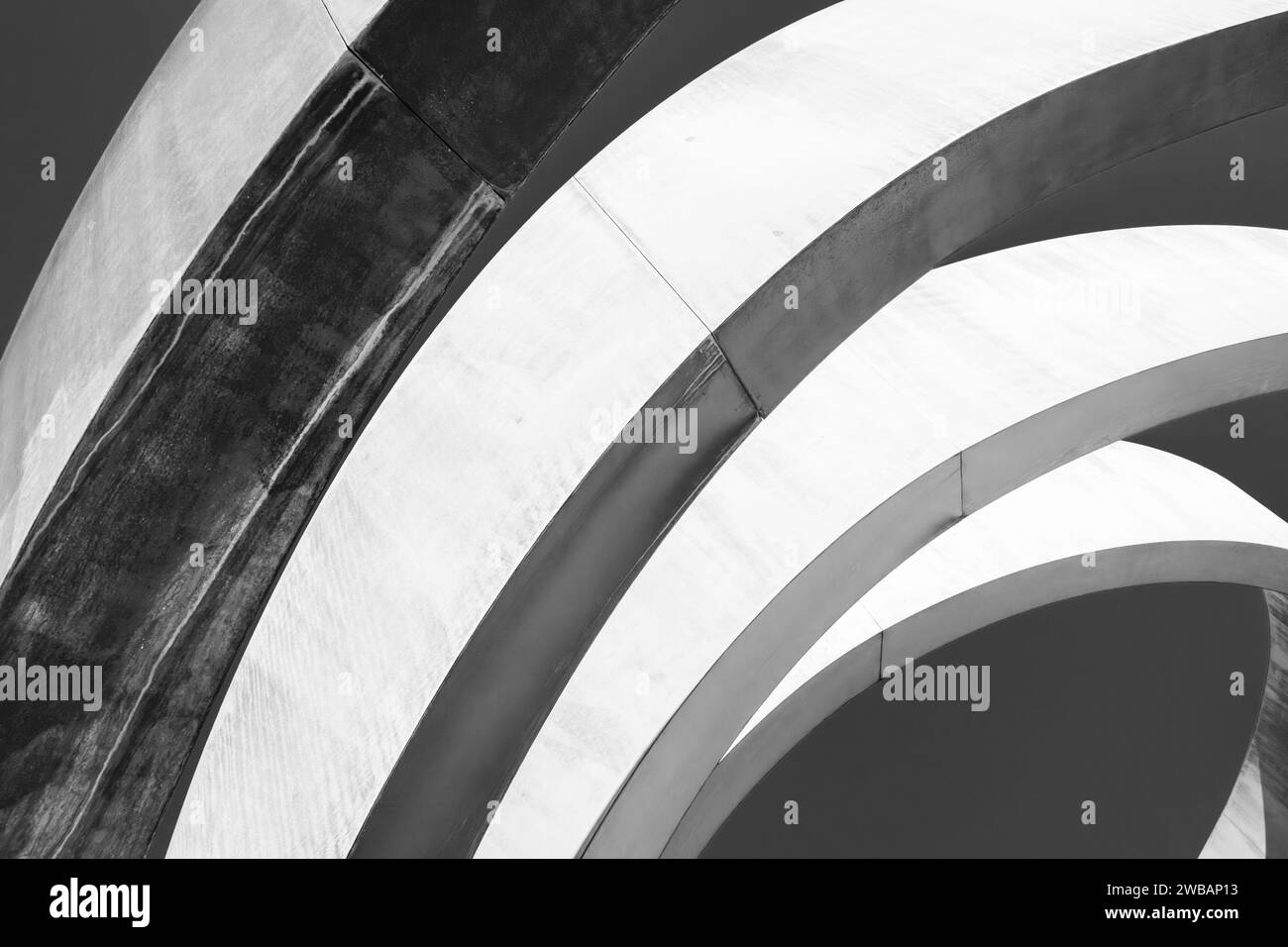 Striking monochrome architectural feature with sweeping curves and a ...