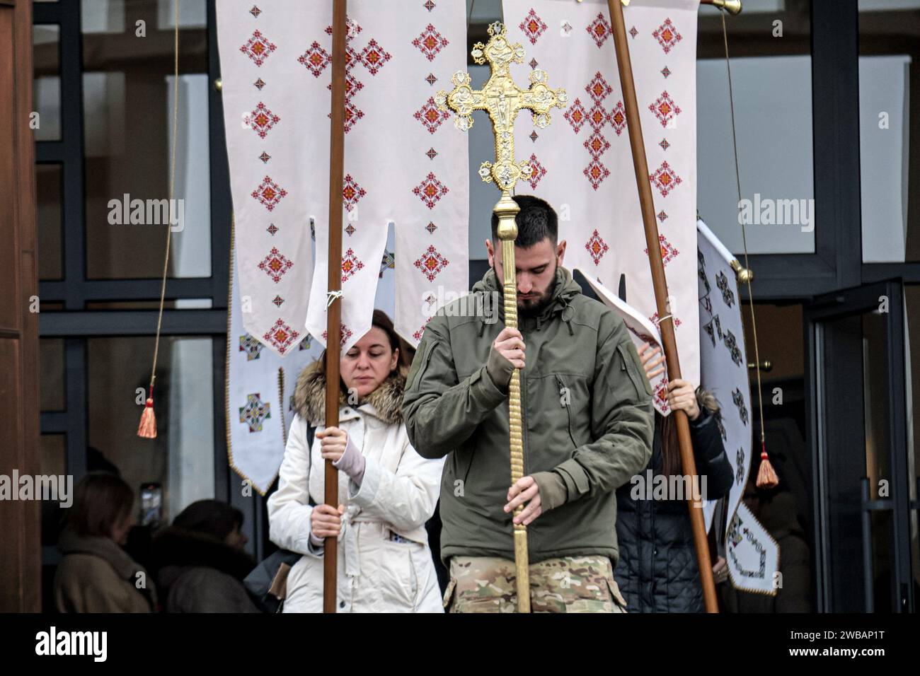 KYIV, UKRAINE - JANUARY 6, 2024 - Devotees carry religious banners ...