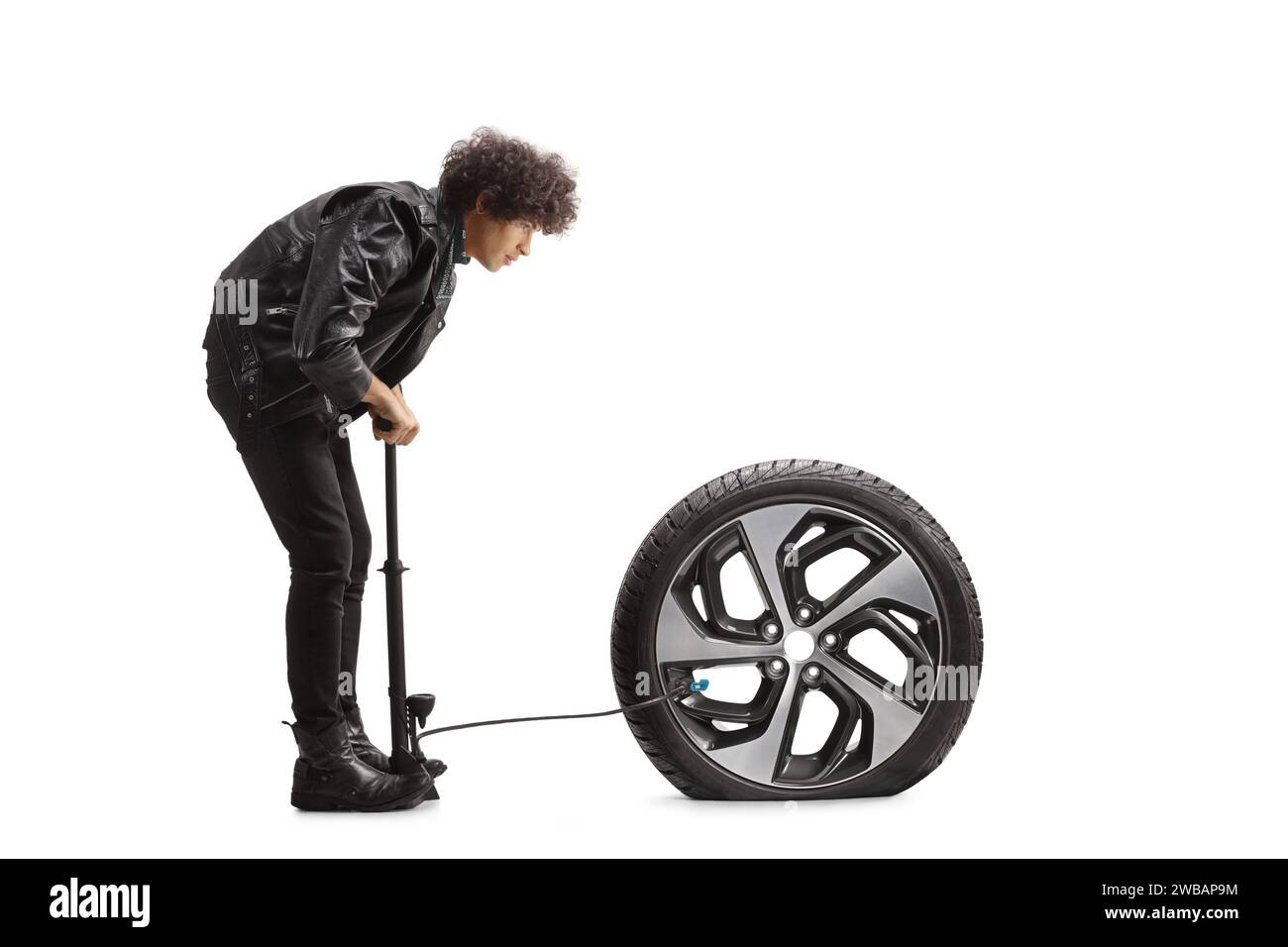 Young man pumping a flat car tire isolated on white background Stock ...