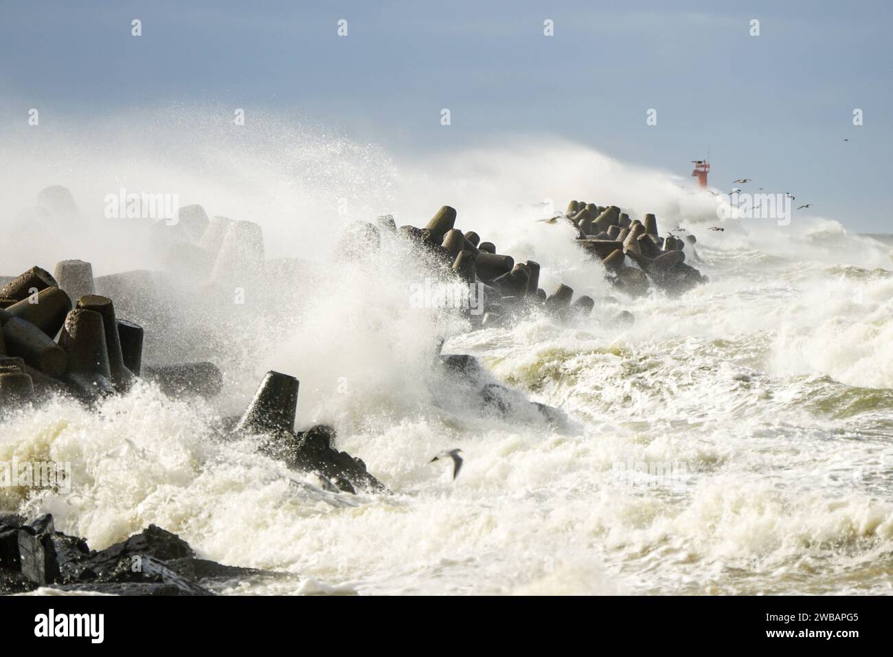 Storm at sea, high waves crashing against the concrete breakwaters of ...