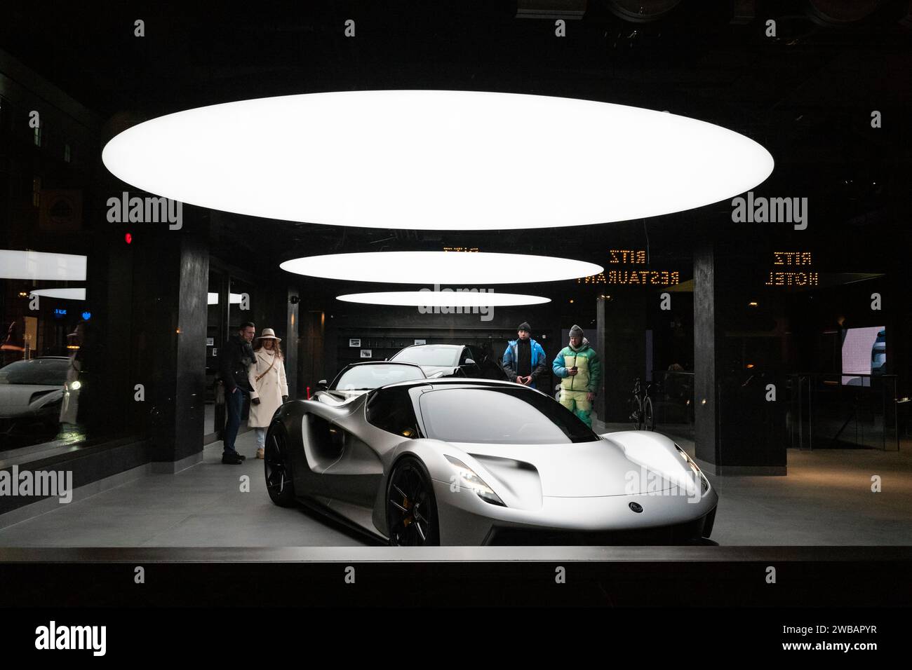 LOTUS super car show illuminated at night time along Piccadilly ...