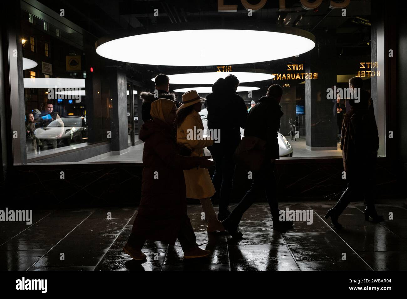 LOTUS super car show illuminated at night time along Piccadilly ...