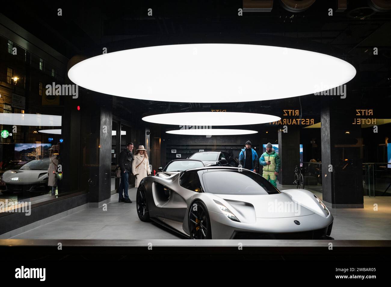LOTUS super car show illuminated at night time along Piccadilly ...