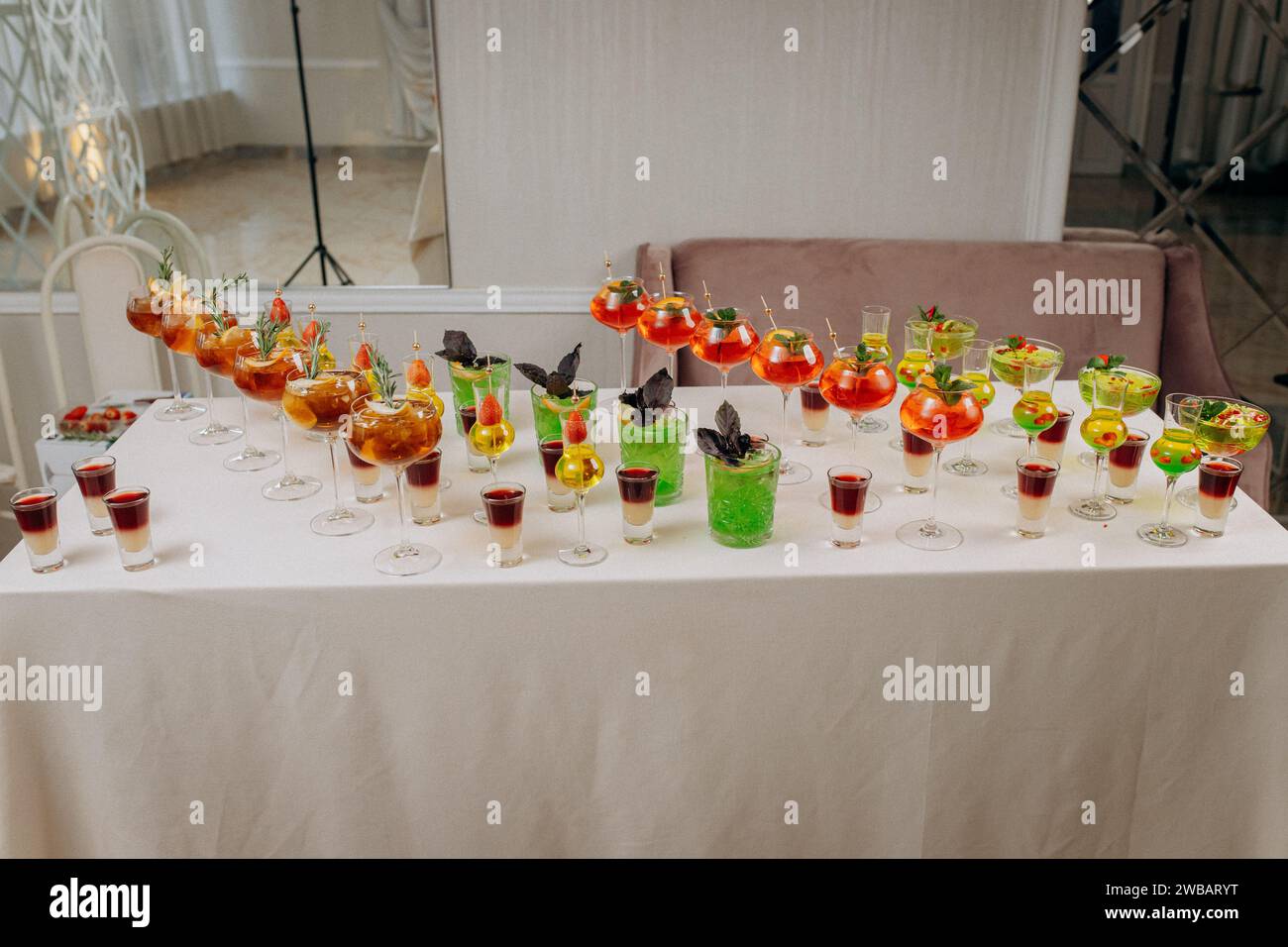 Welcome drink with cocktail glasses and drinks at an event. Alcoholic ...