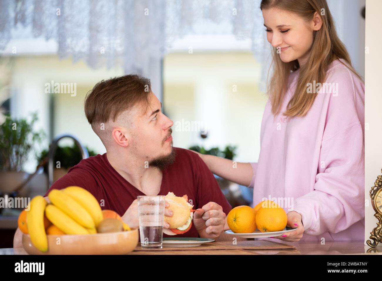 Eating a healthy meal in the kitchen in the morning Stock Photo - Alamy