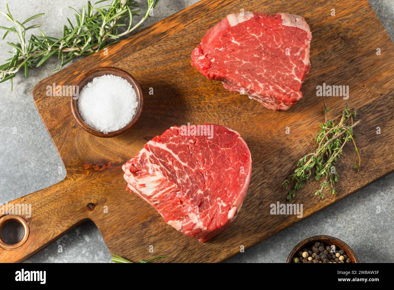 Raw Grass Fed Filet Mignon Steak with Salt and Pepper Stock Photo - Alamy