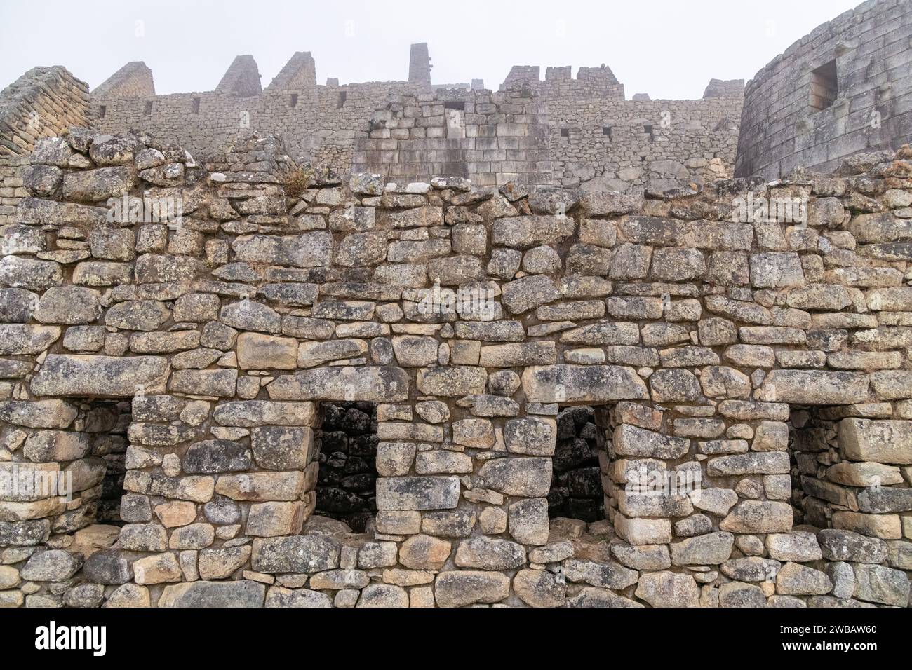 Empty granite stone building structures at Machu Picchu in Peru Stock ...