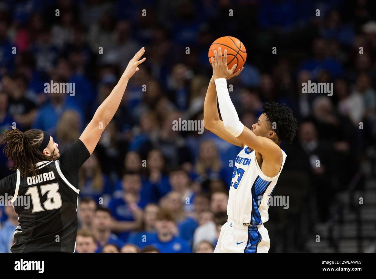 Providence's Josh Oduro (13) reaches to block a shot from Creighton's ...
