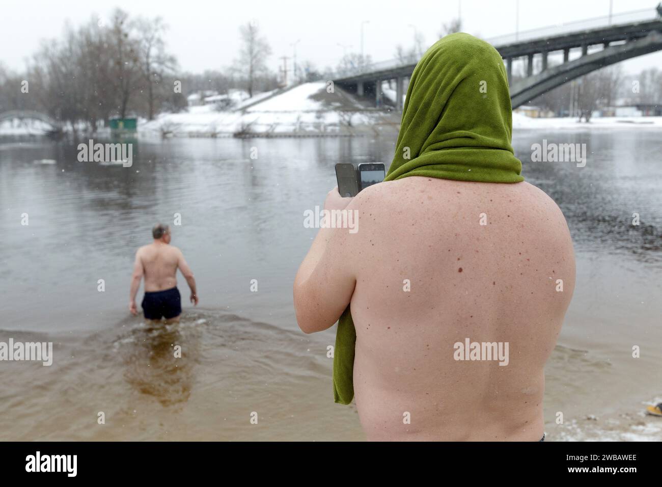 KYIV, UKRAINE - JANUARY 6, 2024 - A man takes pictures during the ...