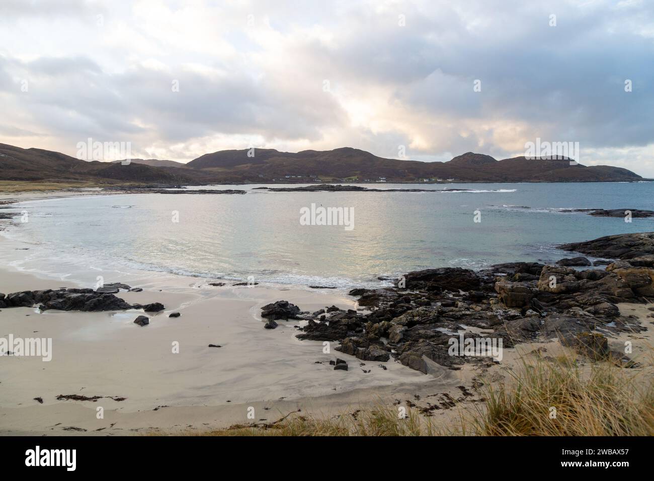 The beach at Sanna Bay looking across to the remote community of ...