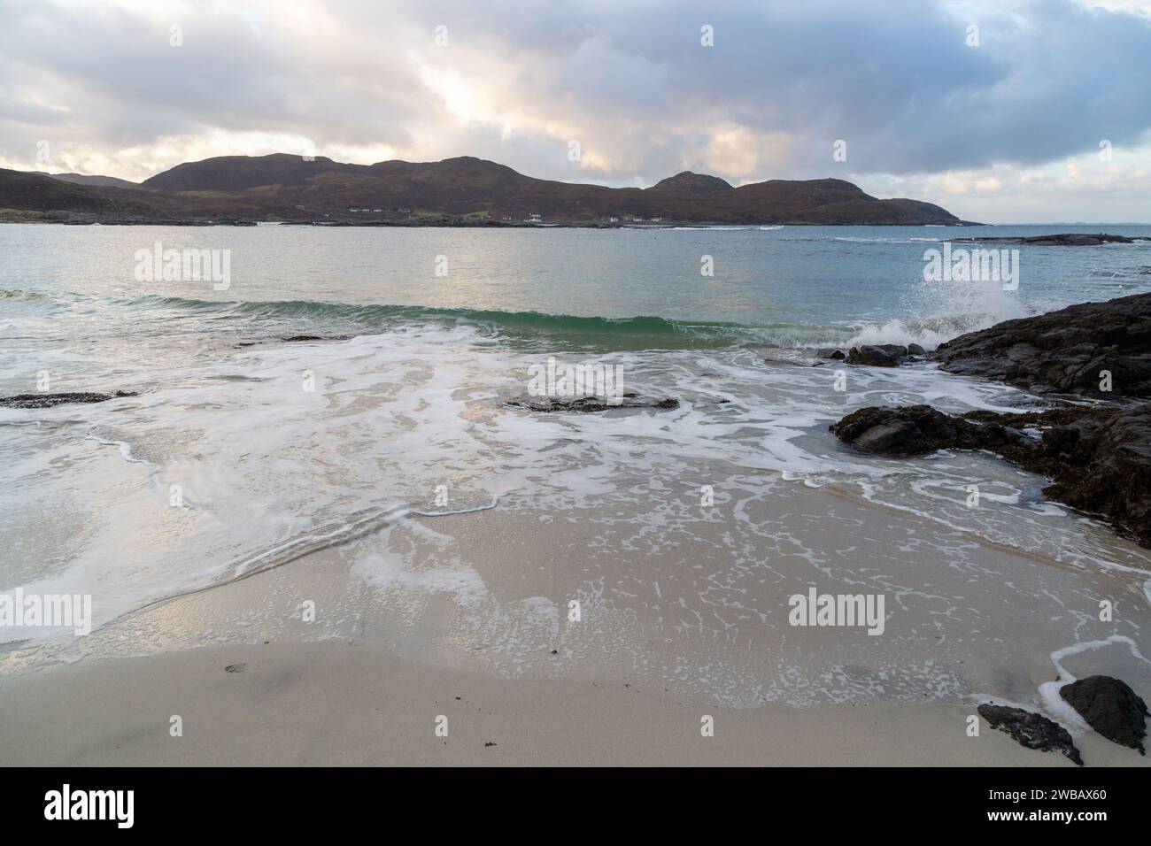 The beach at Sanna Bay looking across to the remote community of ...