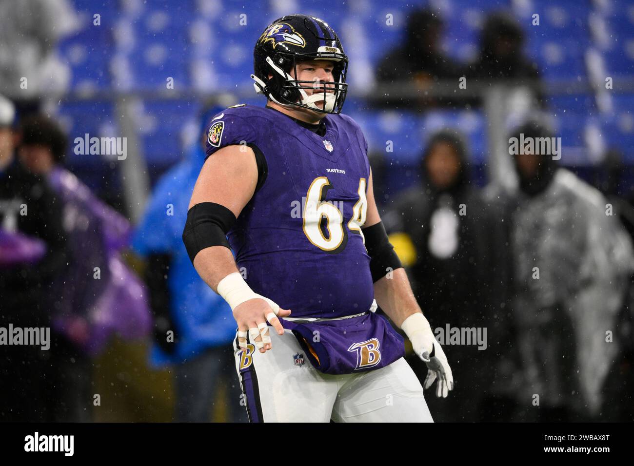 Baltimore Ravens center Tyler Linderbaum (64) works out before an NFL ...