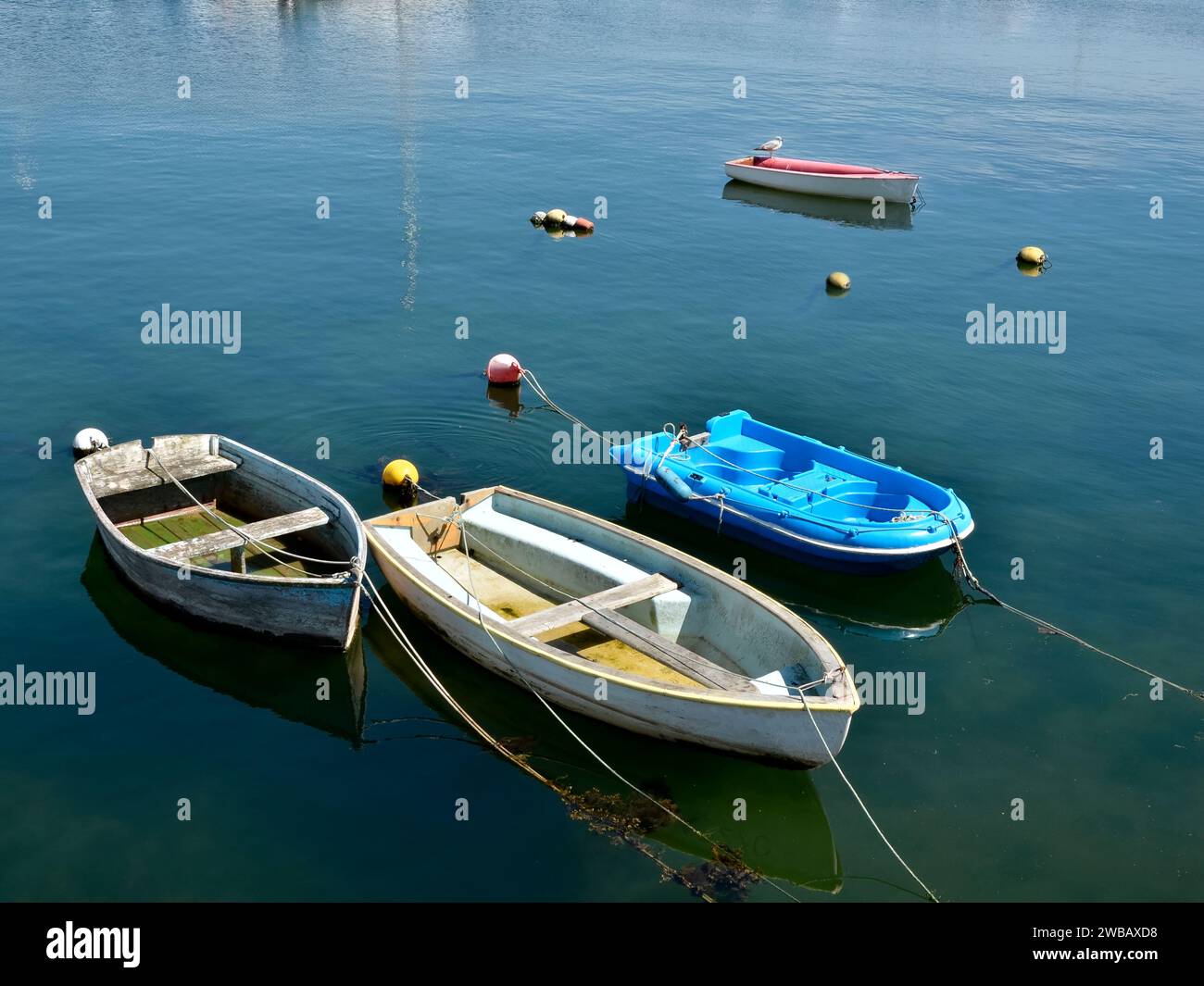 Small boats seen from above moored at a quay of a French Brittany port ...