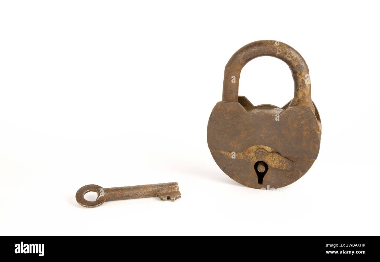 An old rusty padlock on a white background. A key for the lock Stock ...