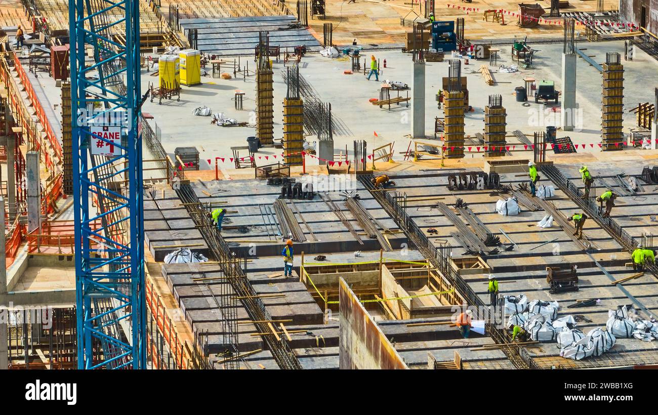 Aerial View of Bustling Construction Site with Crane and Workers in ...