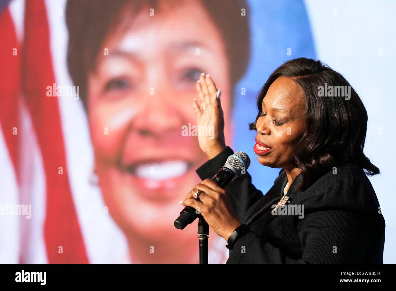 Sondra Johnson sings "We Shall Behold Him"during funeral services for ...