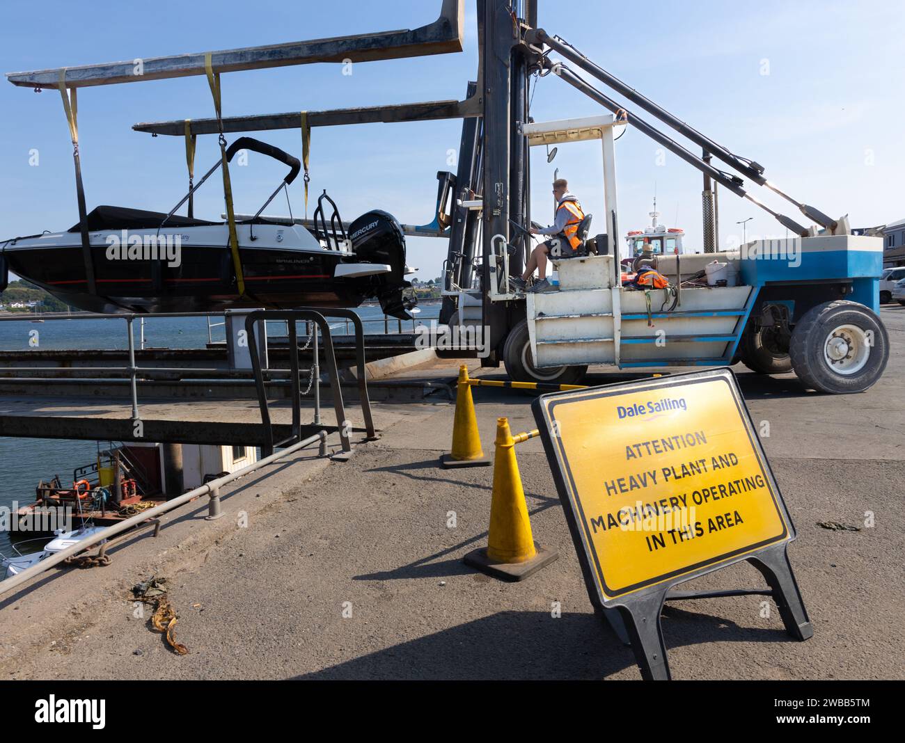 Boat lift and safety sign in boatyard at Nayland near Milford Haven ...