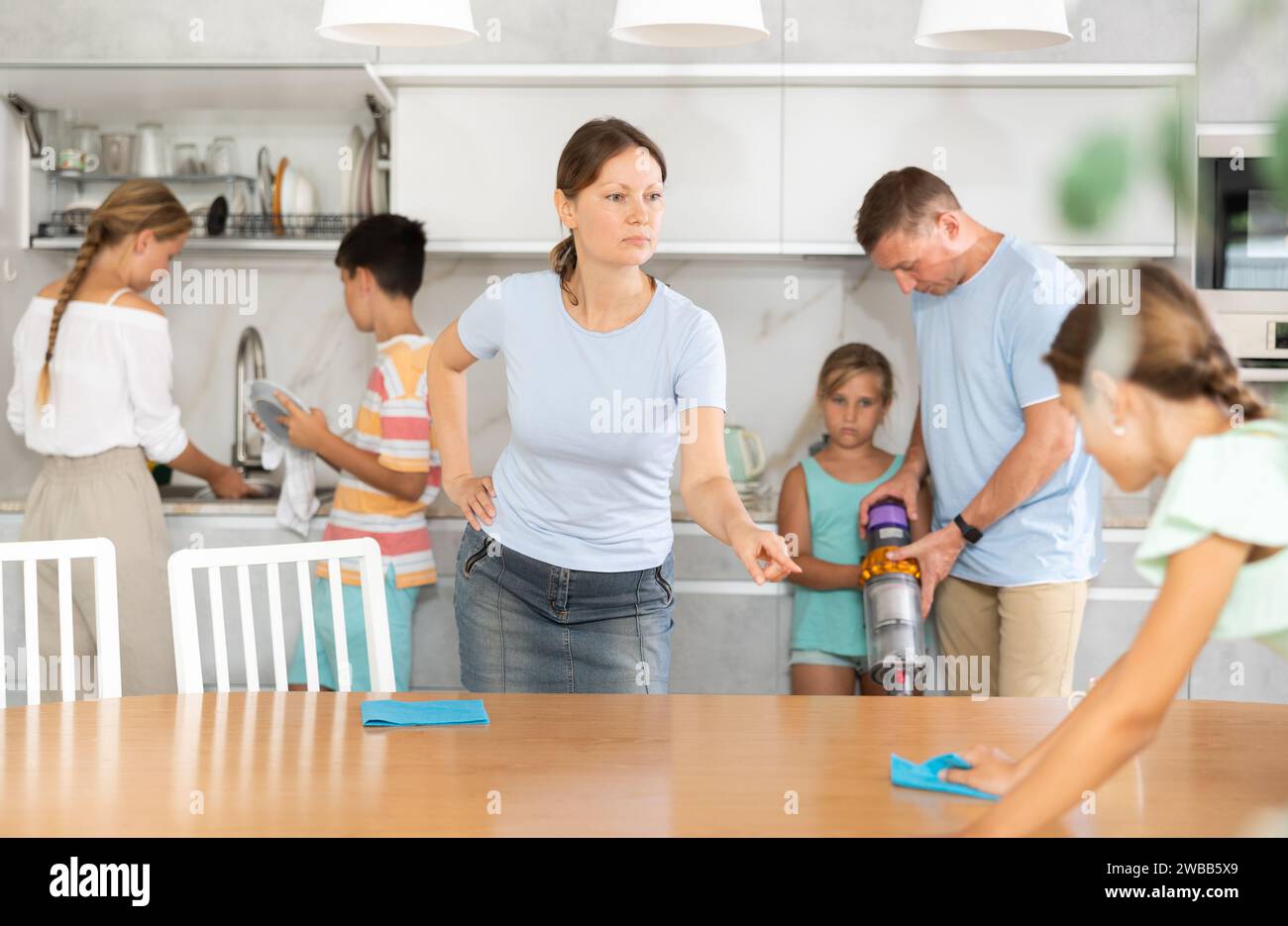 Big family members cleaning their house Stock Photo - Alamy