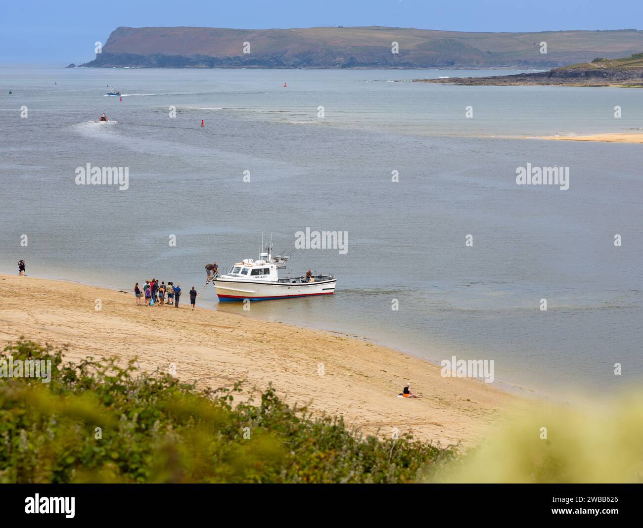Fishing trip boat Emma Kate loading people near the Doom Bar in Camel Estuary. Near Padstow ...