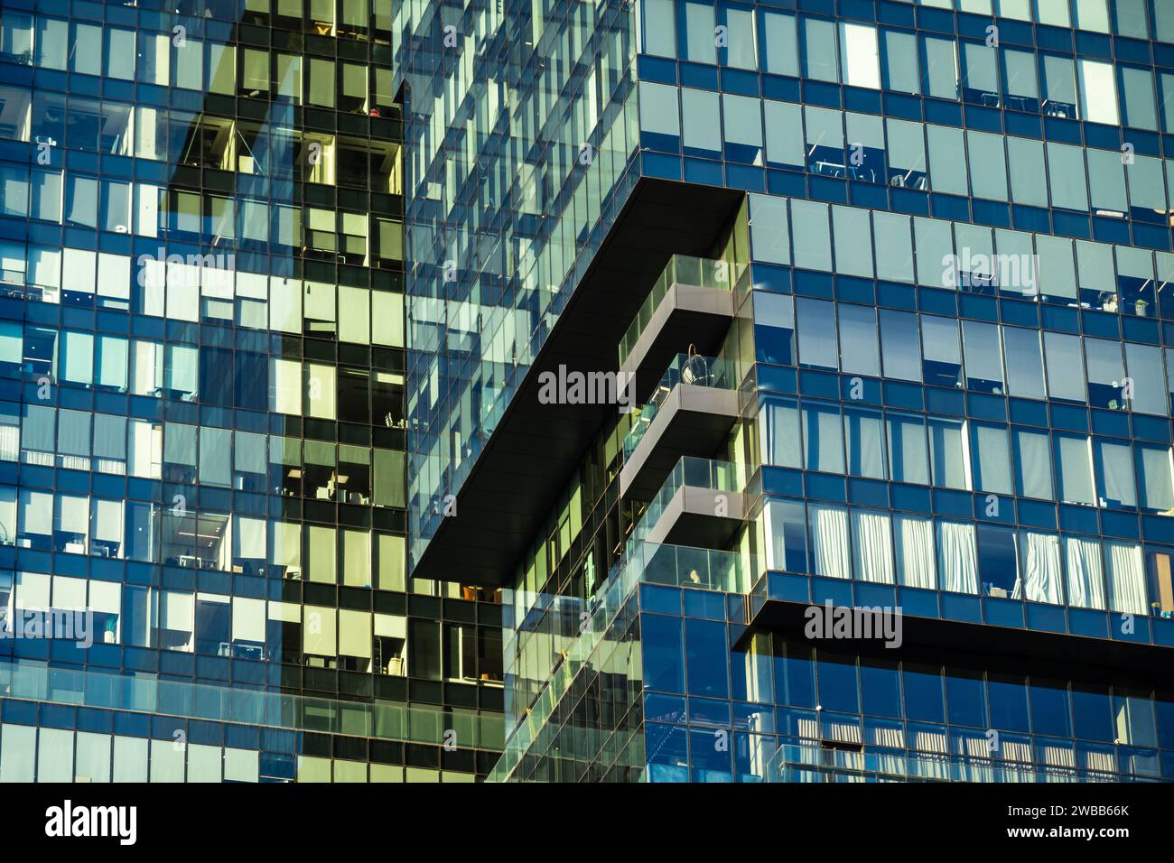 From below of contemporary high rise buildings with glass mirrored ...