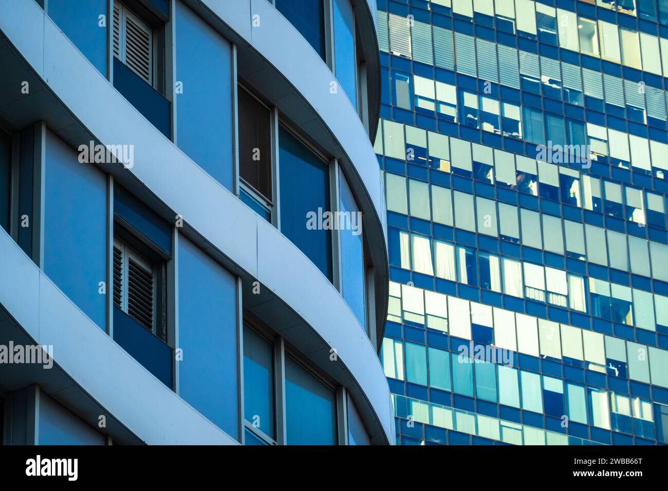 From below of contemporary high rise buildings with glass mirrored ...
