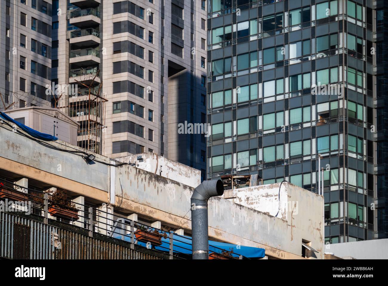 Contrasting architecture with an old building flanked by modern glass ...