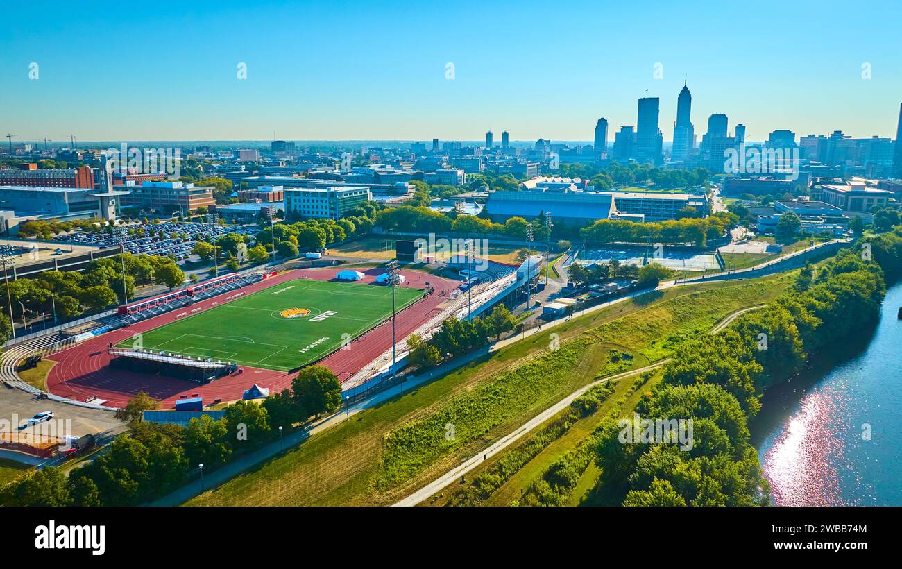 Aerial View of Urban Stadium and City Skyline with River Stock Photo ...