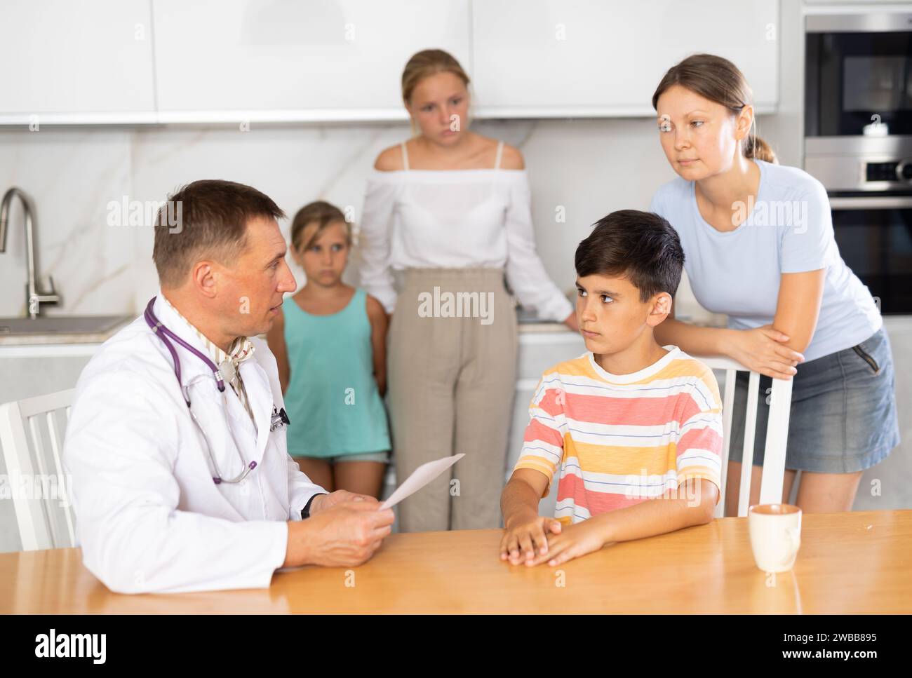 Family male doctor visit at home. Doctor examining children Stock Photo ...