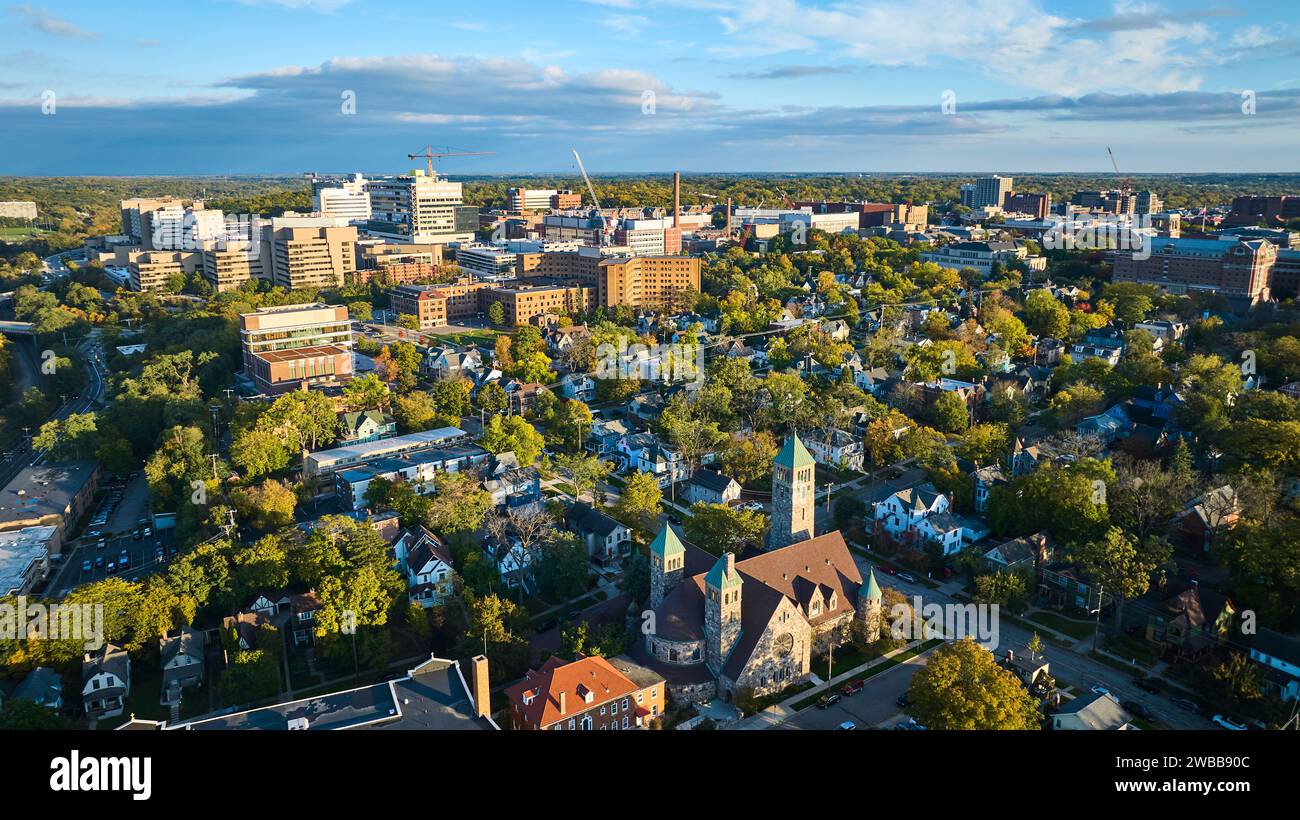Aerial Golden Hour Over Historic Church and Urban Growth, Ann Arbor ...