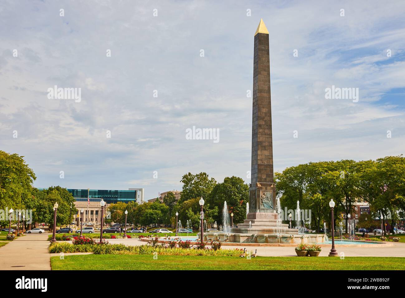 Golden Tipped Obelisk Monument with Fountain in Urban Park ...