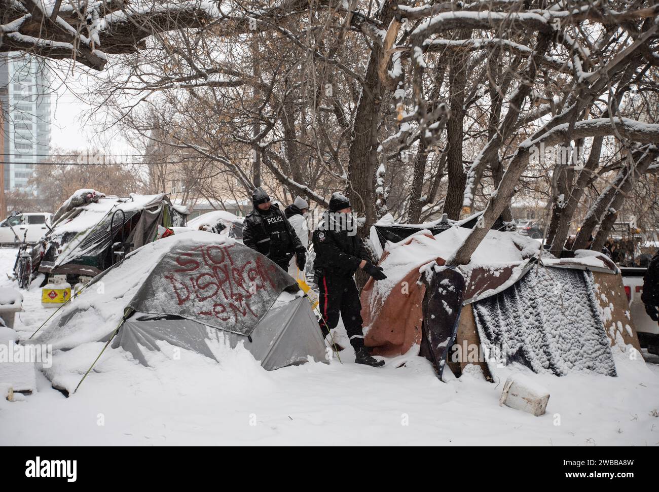 Edmonton, Canada. 09th Jan, 2024. Police inspect a homeless encampment ...