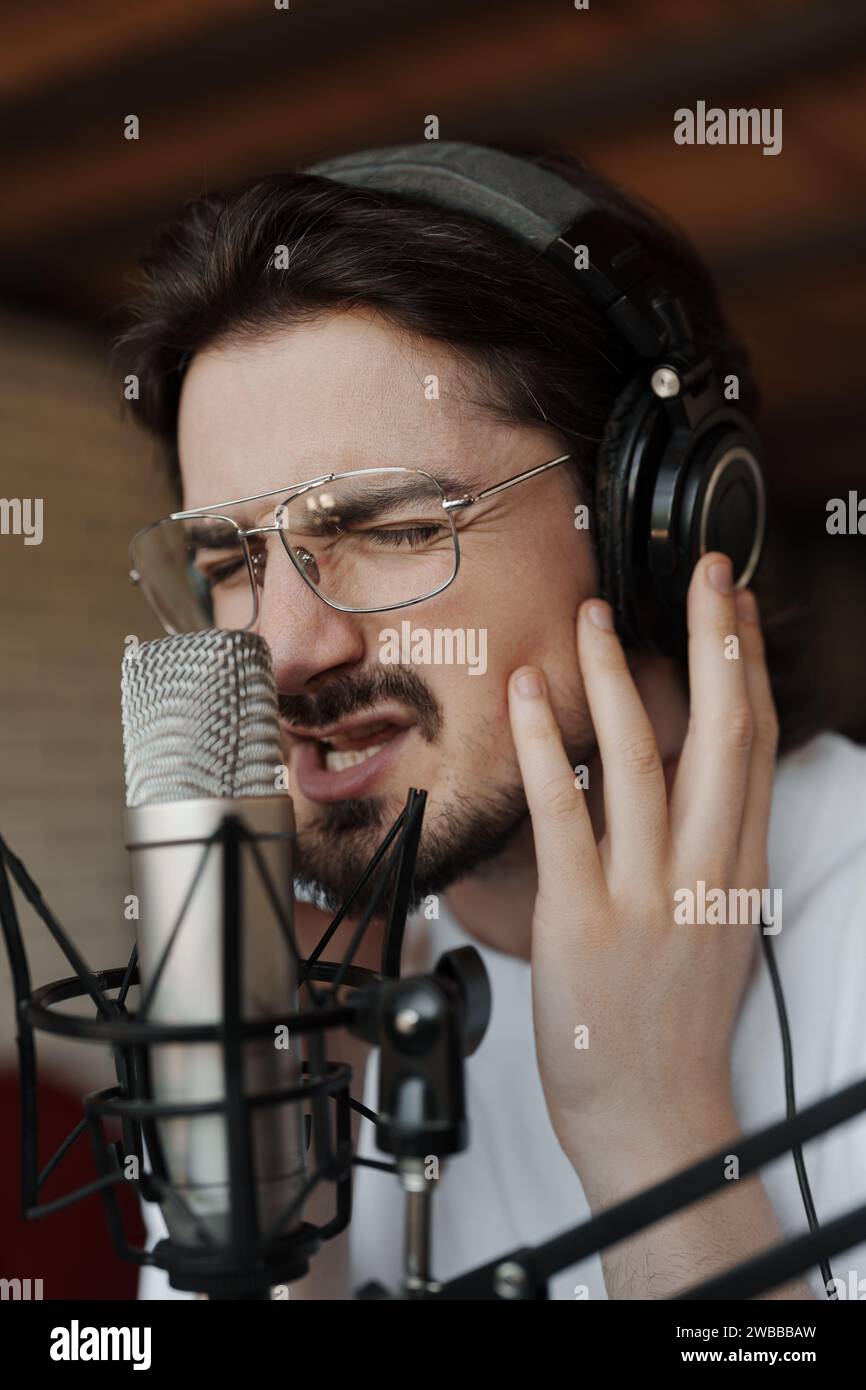 Artist Expressing Emotion in Vocal Recording Stock Photo - Alamy