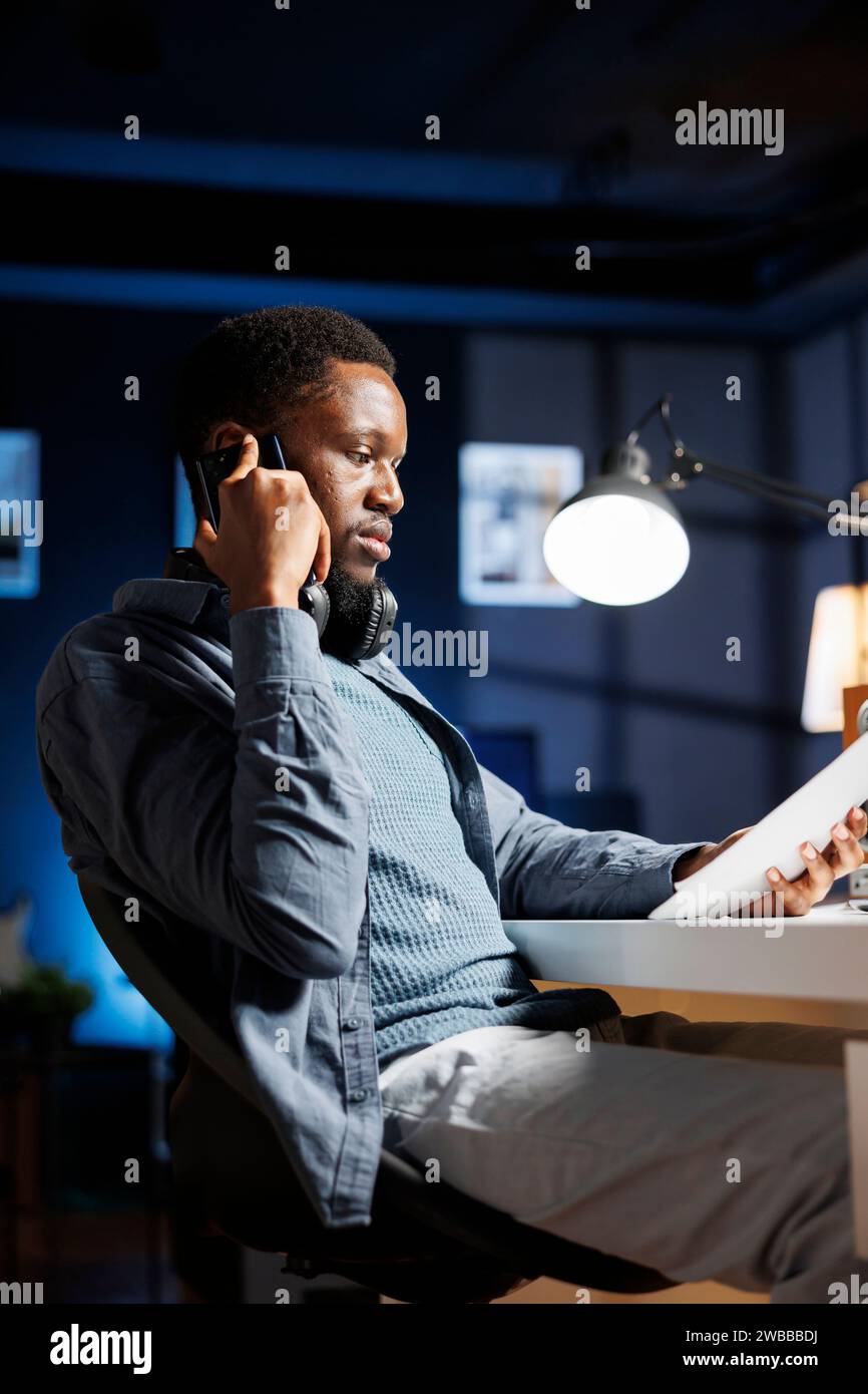 Financial investor analyzing capital balance report papers at home ...