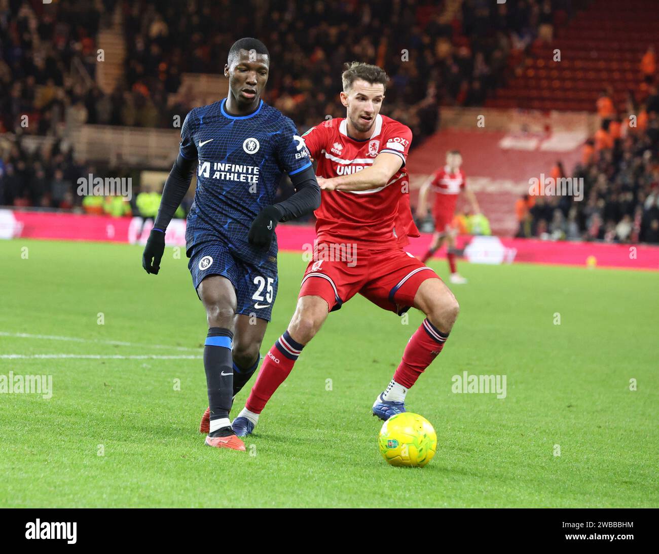 Dan Barlaser of Middlesbrough In action with Moises Caicedo of Chelsea ...