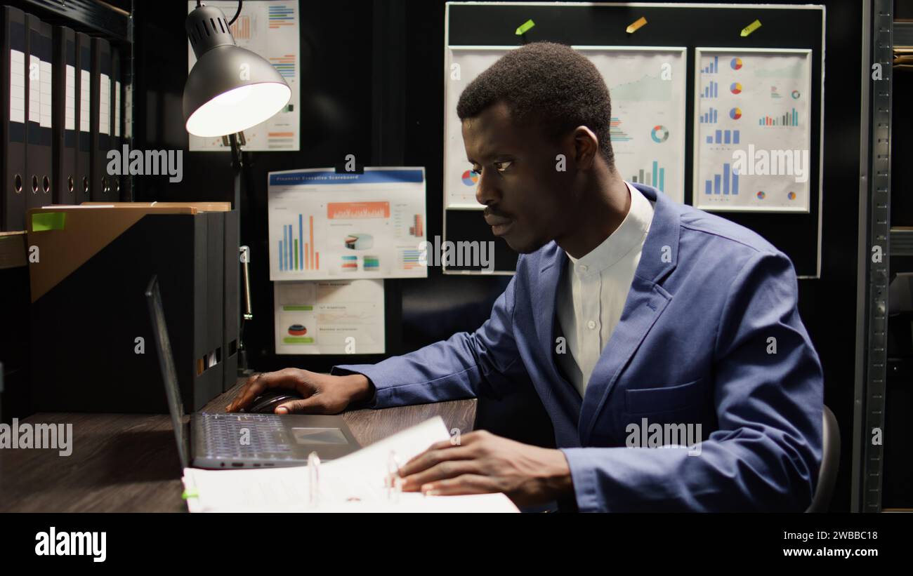 Detective inspector works in office, analyzing forensic evidence and ...