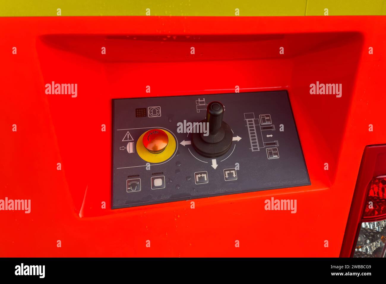 Close view of the control panel with joystick and start button on a ...