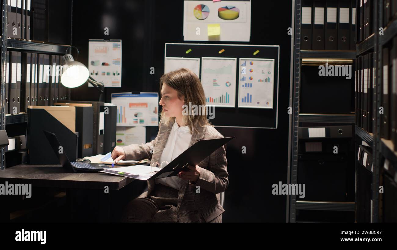 Private investigator enters office with case folder, examining evidence ...