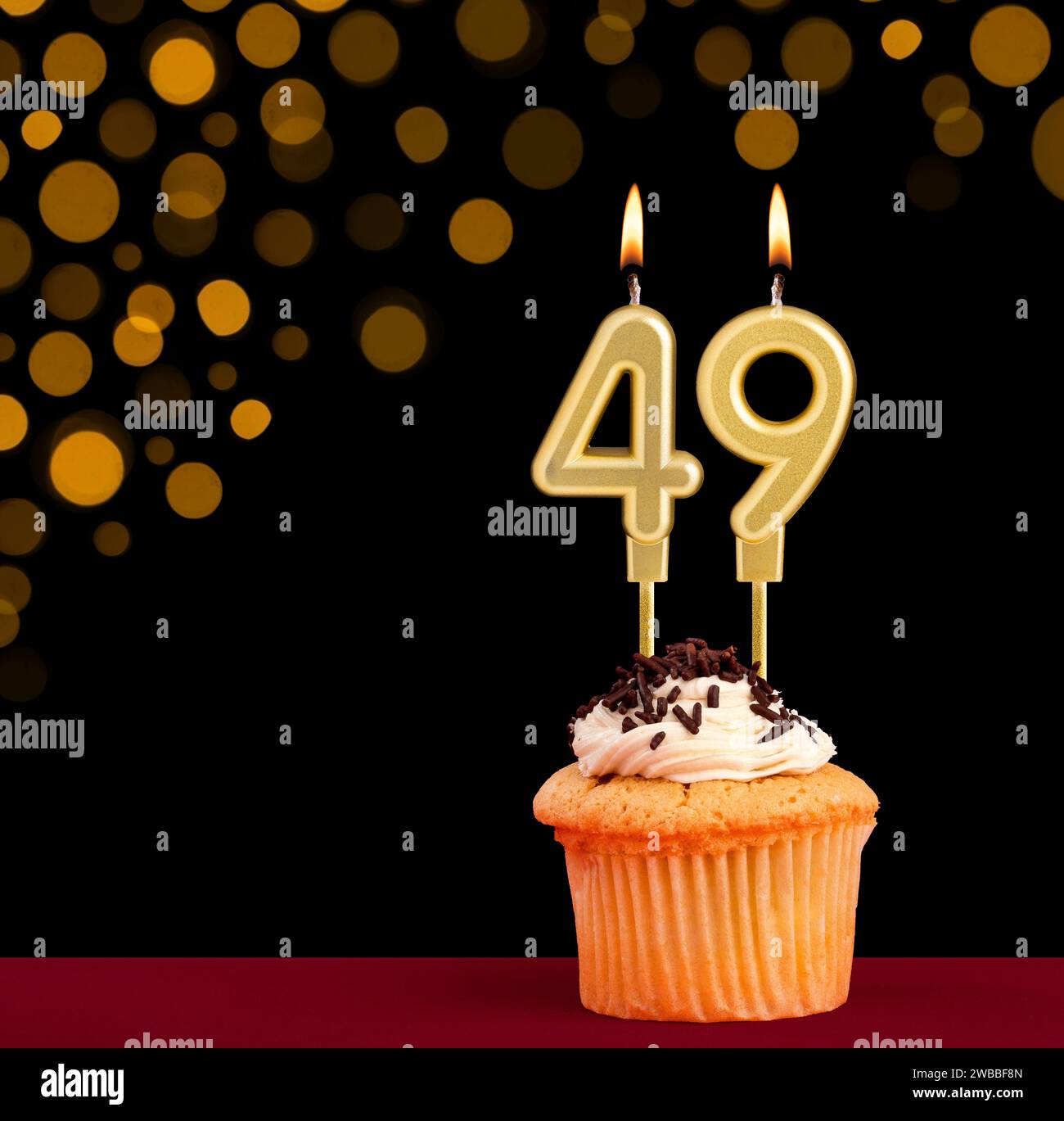Number 49 birthday candle - Cupcake on black background with out of ...