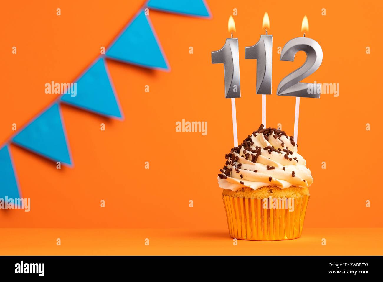 Birthday cake with candle number 112 - Orange background Stock Photo ...