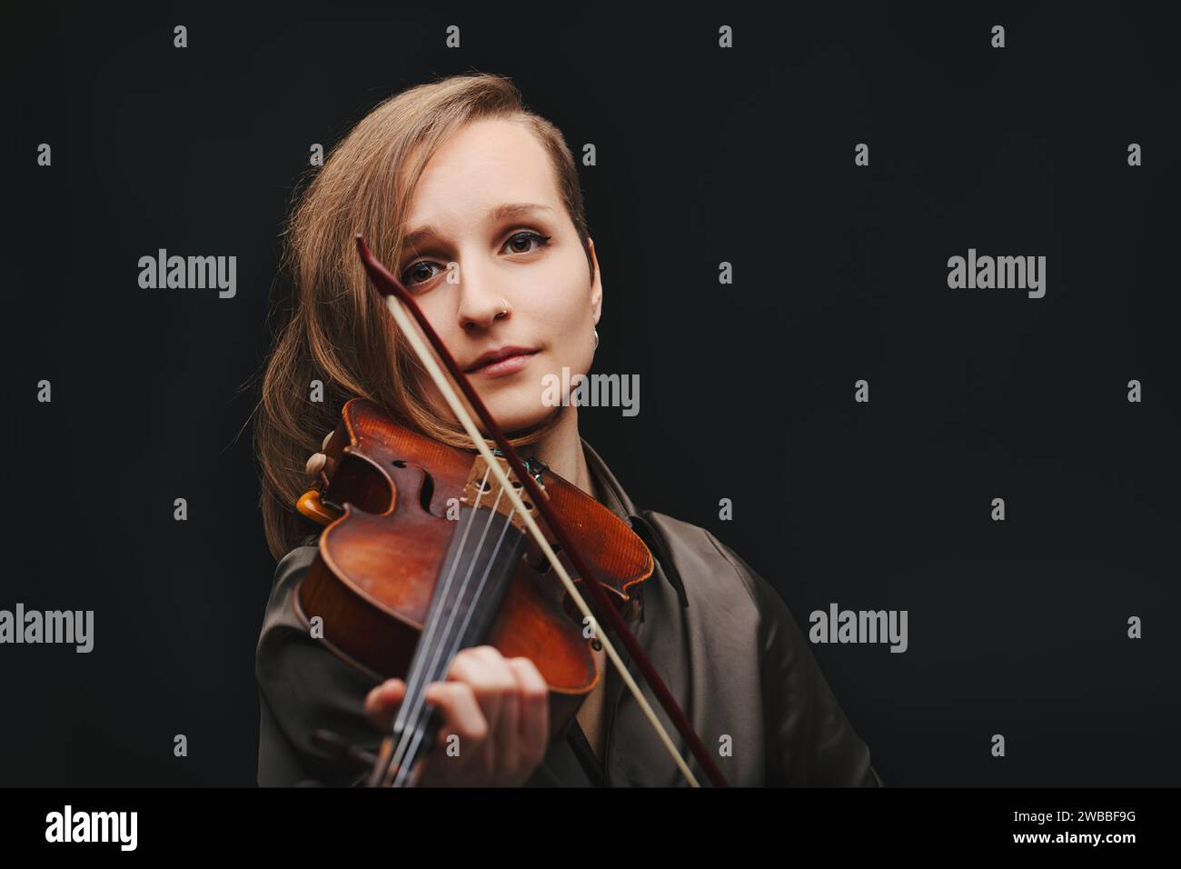 The artist's connection with her violin shines through, showcasing the ...